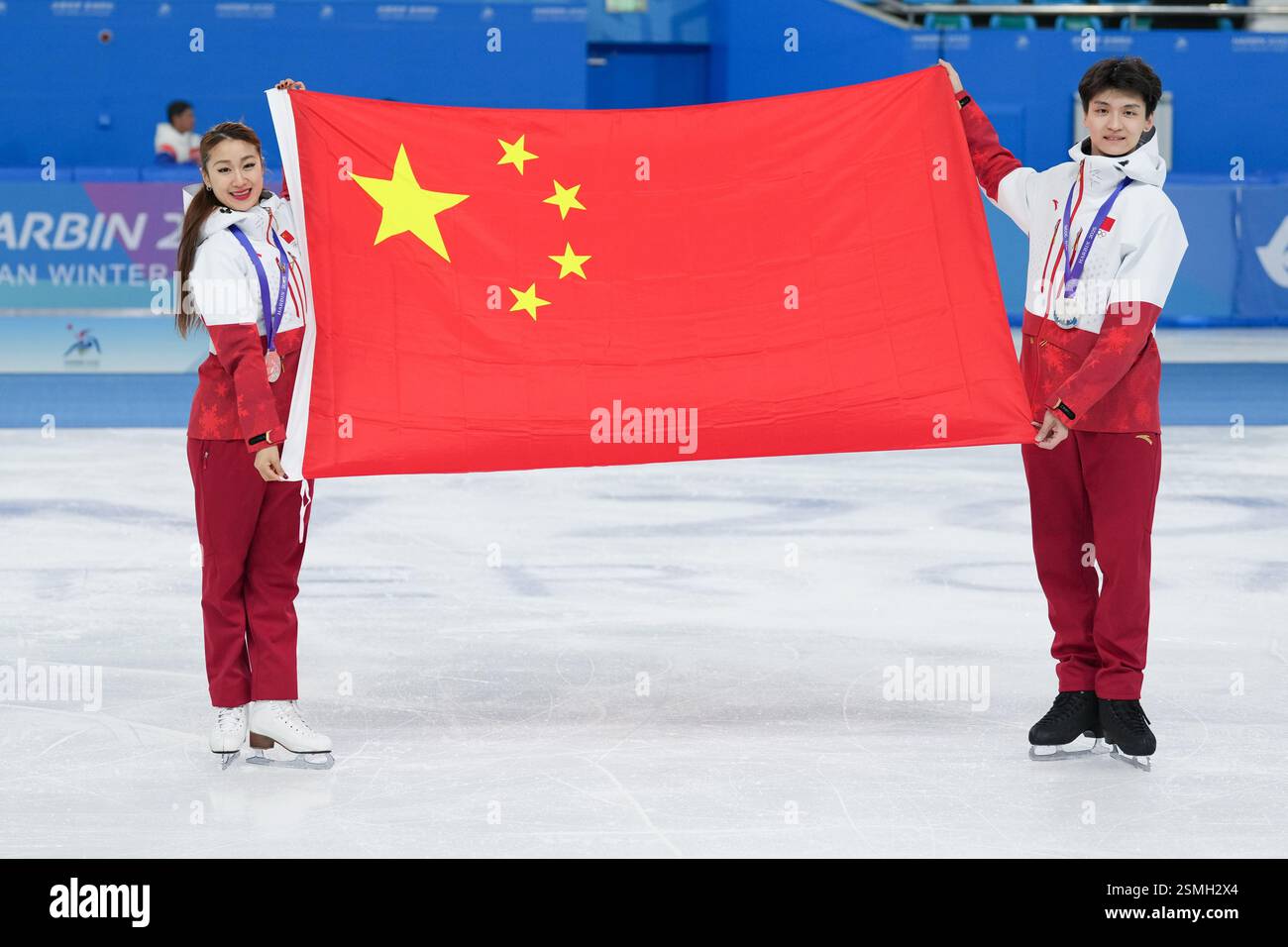 Harbin,China.12th February 2025. Sliver medalist Ren Junfei and Xing ...