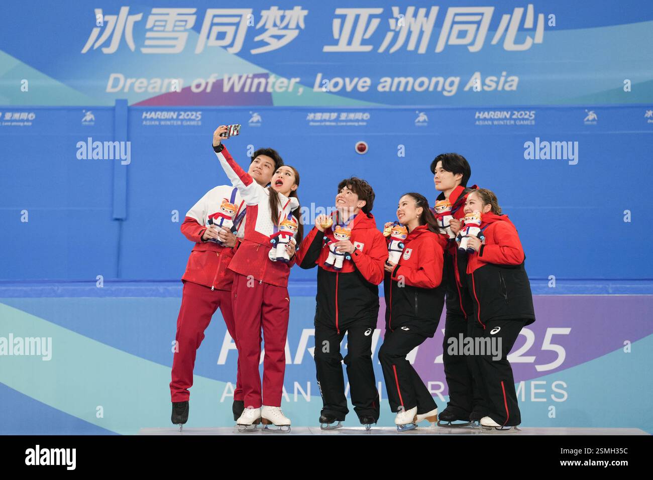 Harbin,China.12th February 2025. (LR) Sliver medalist Xing Jianing and ...