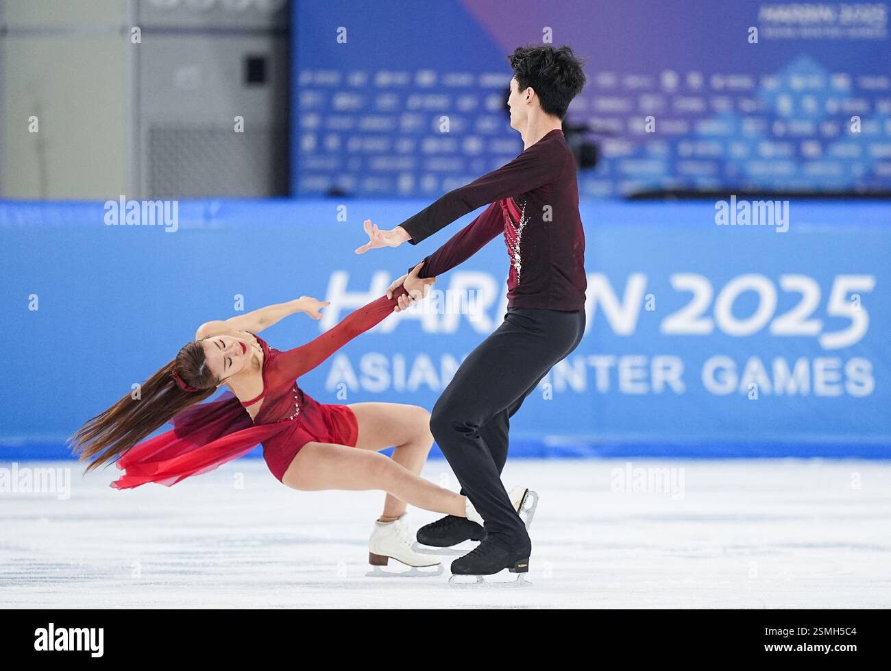 Harbin,China.12th February 2025. Ren Junfei and Xing Jianing compete in ...