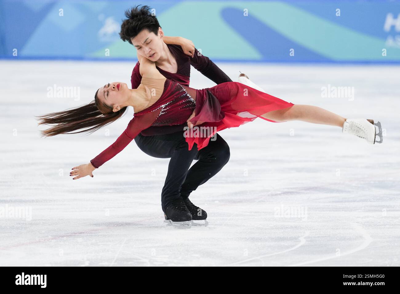 Harbin,China.12th February 2025. Ren Junfei and Xing Jianing compete in ...