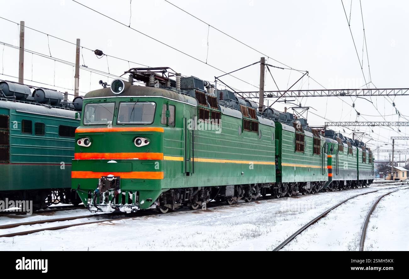 Soviet-built old freight electric locomotive in winter at Kyiv depot ...