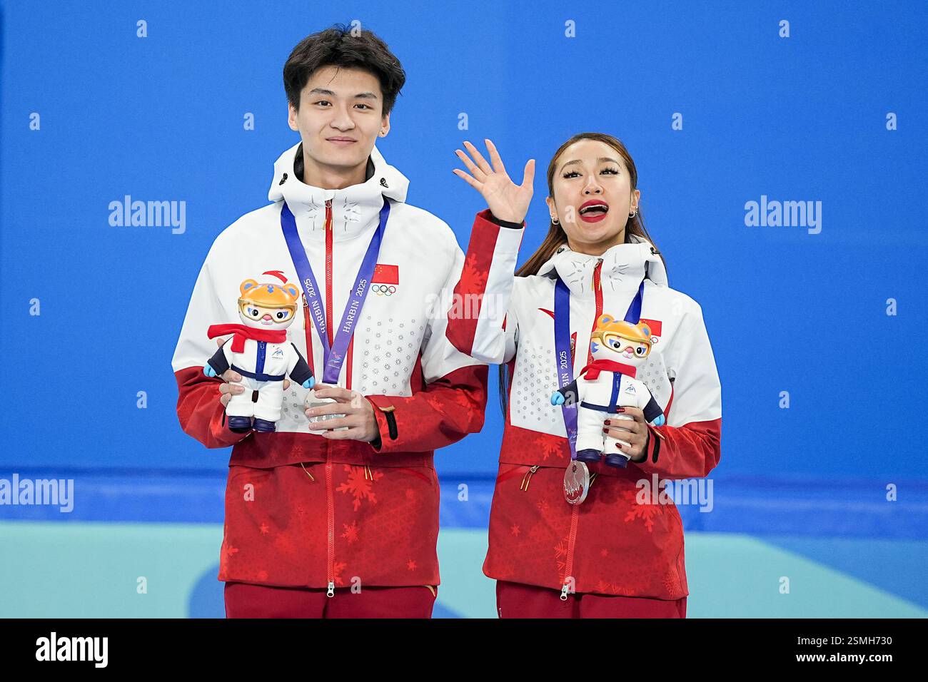 Harbin,China.12th February 2025. Sliver medalist Ren Junfei and Xing ...
