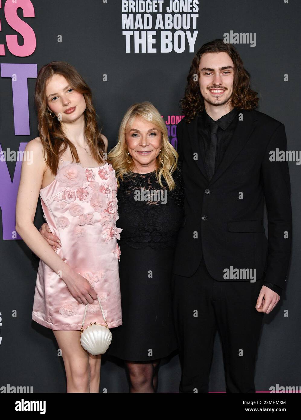 Author Helen Fielding, center, poses with children Romy Curran, left ...
