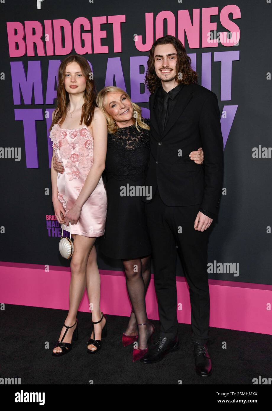 Author Helen Fielding, center, poses with children Romy Curran, left ...