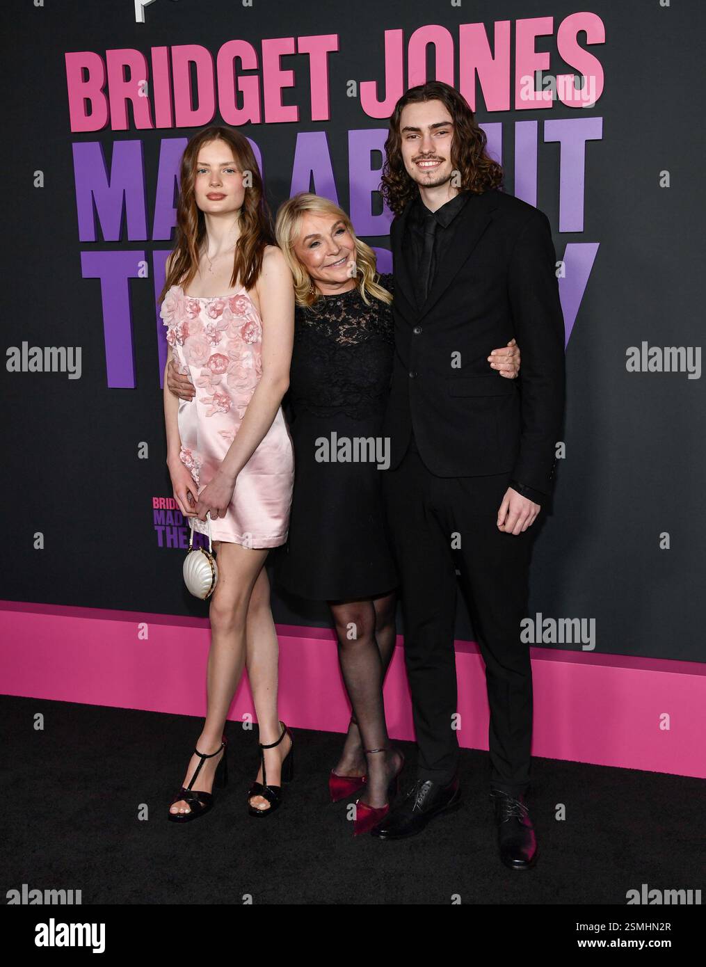 Author Helen Fielding, center, poses with children Romy Curran, left ...