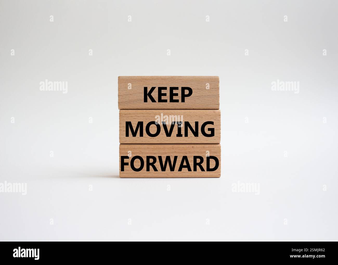 Keep moving forward symbol. Concept words keep moving forward on wooden blocks. Beautiful white ...