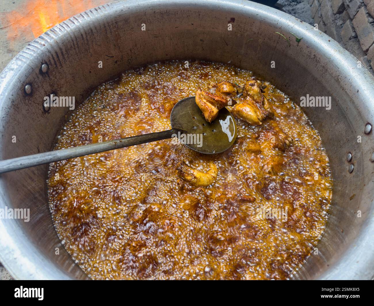 Frying Chicken Pieces in Boiling Oil at Outdoor Wedding Cooking. Frying ...