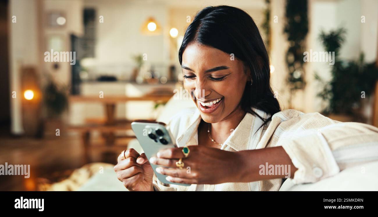 Woman, phone and laughing with texting on sofa in home, chat and funny ...