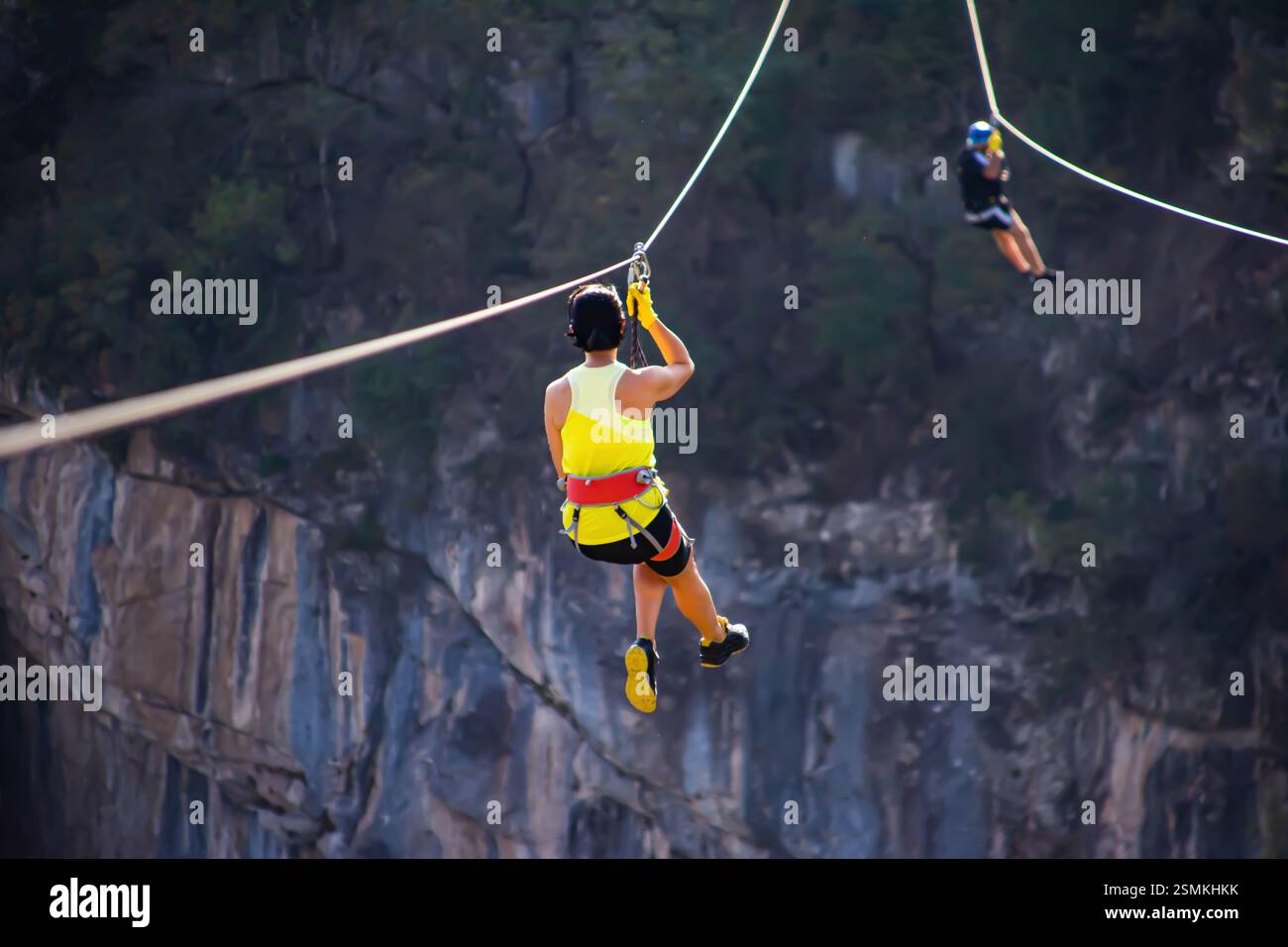 Zipline in the forest. Beautiful view from zip line. Riding on a zip ...