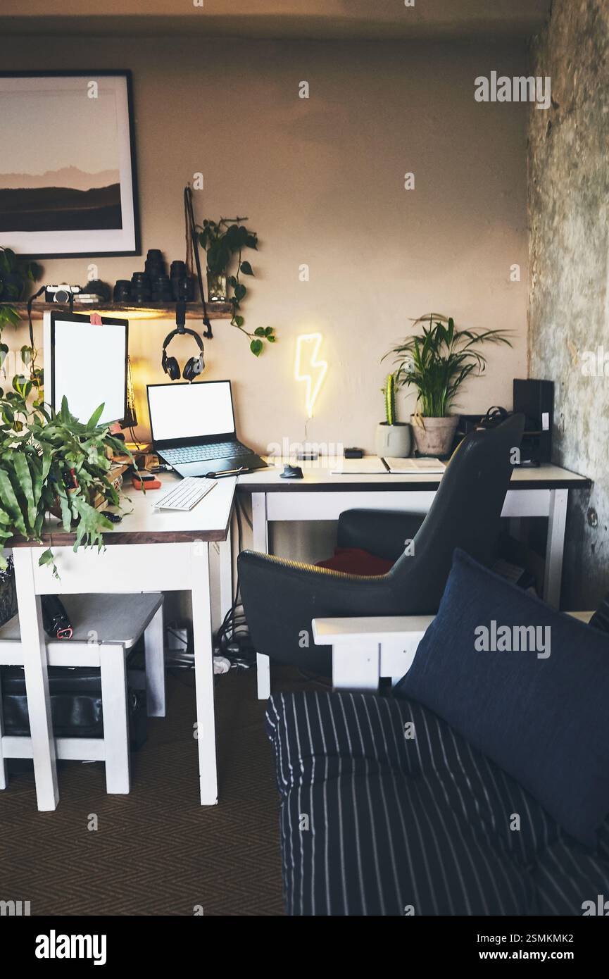 Empty, office and laptop on furniture, screen and equipment for setup ...