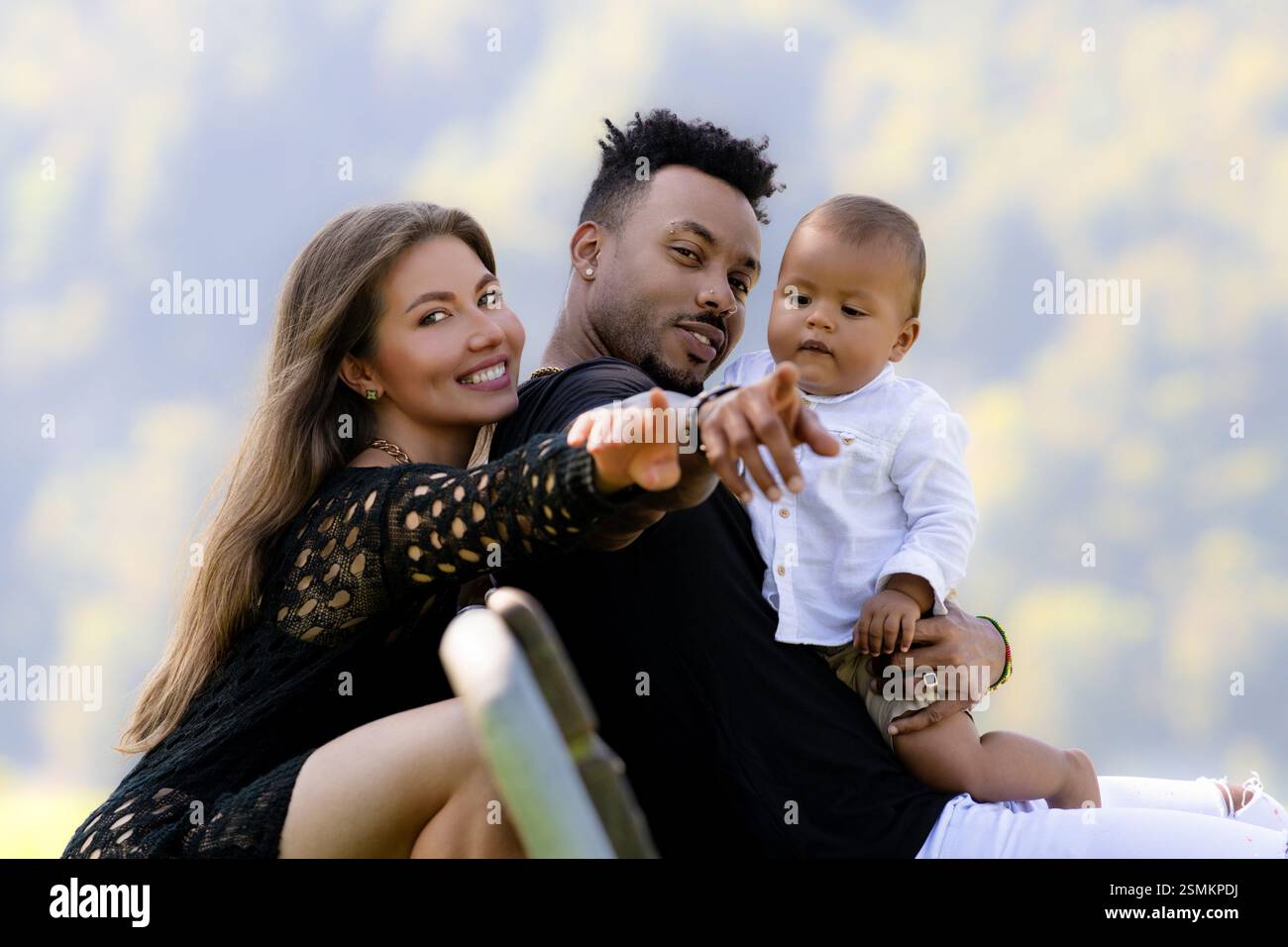Multiethnic parents Biracial baby in park. Multiracial couple outdoor ...