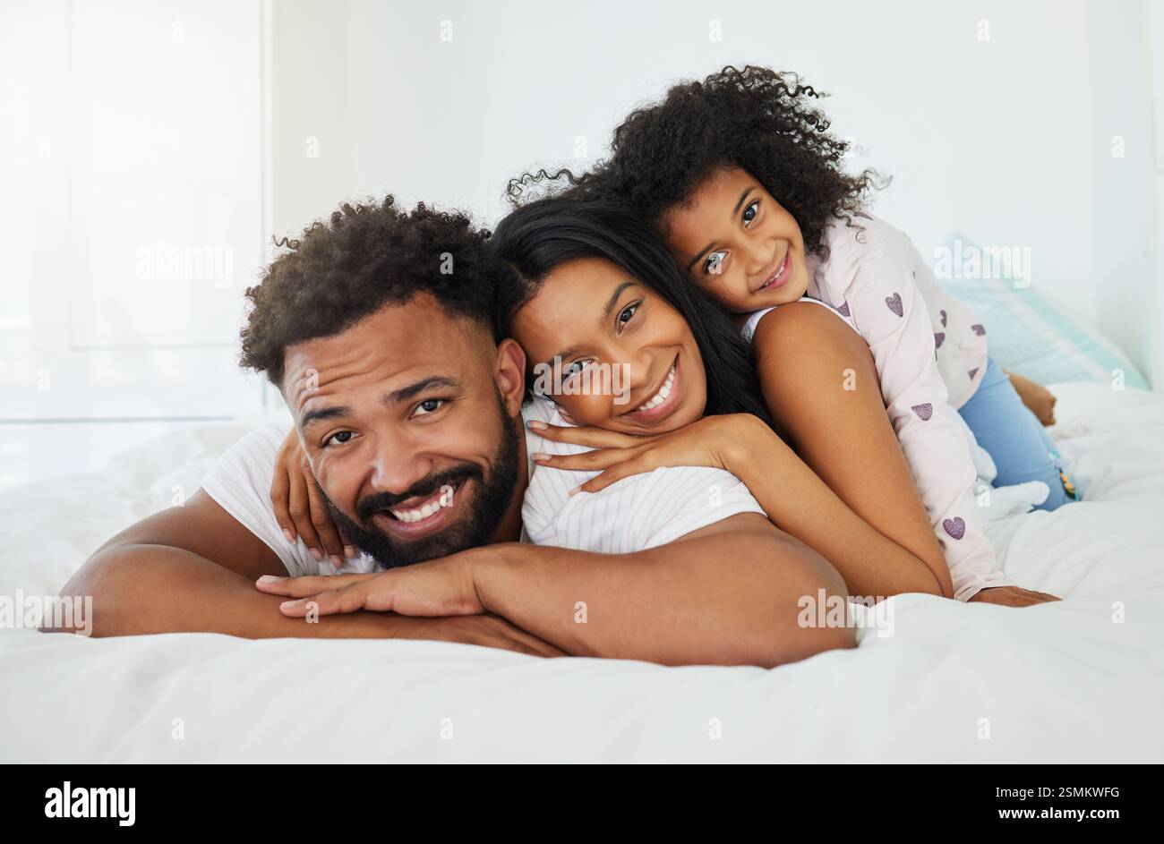Family, portrait and relax together in home, morning wake up and ...