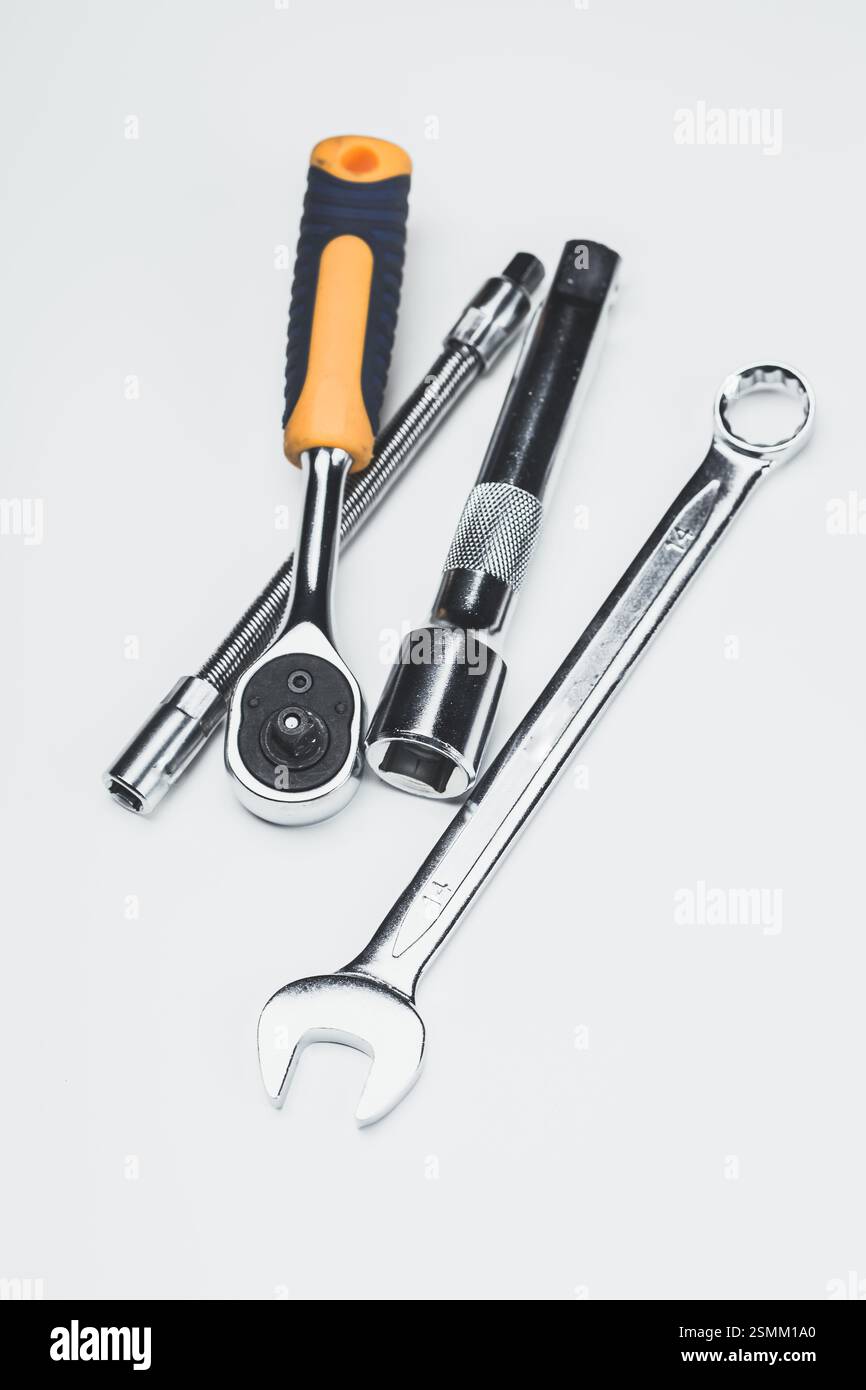 Essential hand tools including a ratchet, extension, and wrench for ...