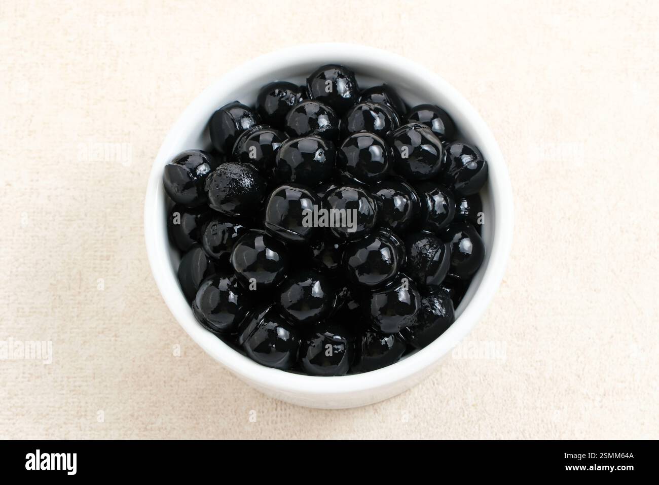 Black boba tapioca pearls, topping in bubble tea or other beverage ...