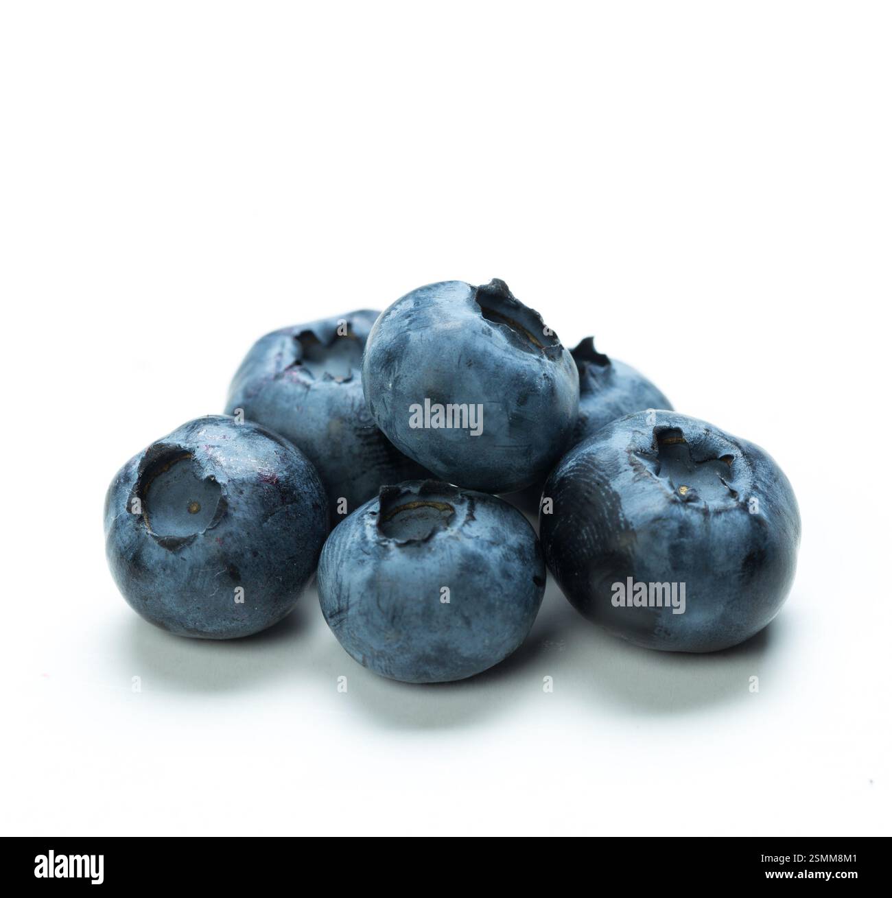 Fresh blueberries arranged on a white background showcasing their ...