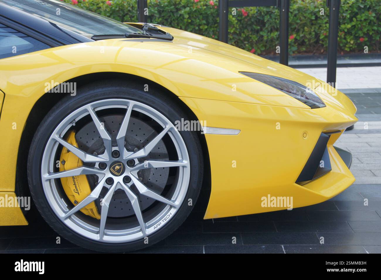 A close-up in Dubai reveals a stunning yellow Lamborghini Aventador S ...
