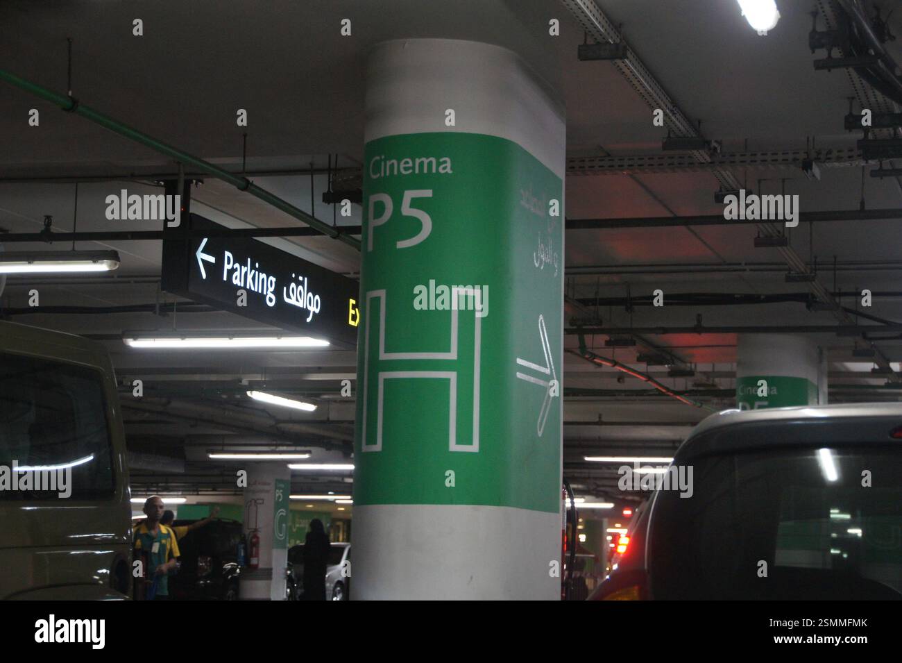 Dubai. Green directional sign with white text and arrow points the way ...