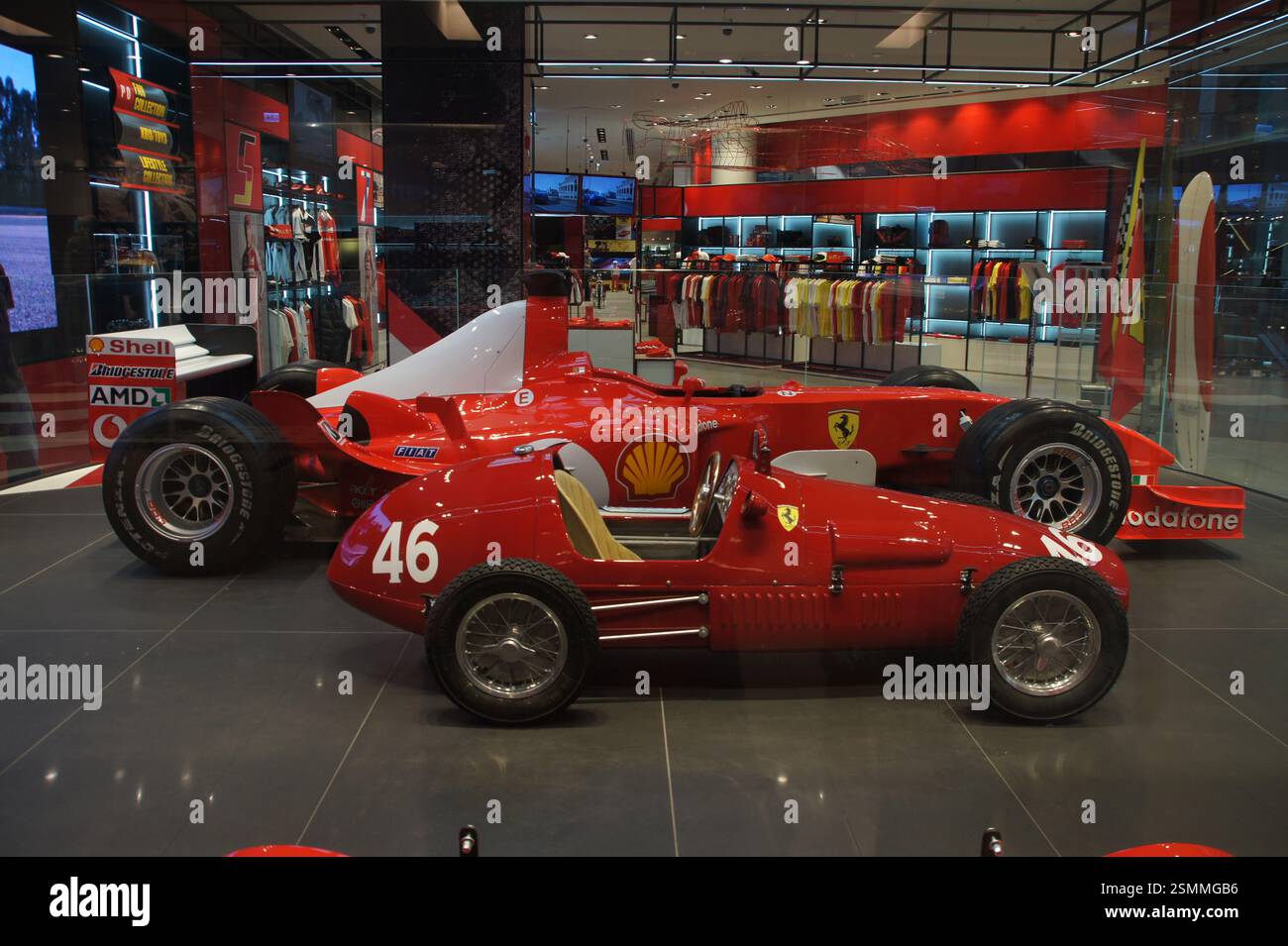 In Dubai, two gleaming red Ferrari race cars grab attention in a store ...