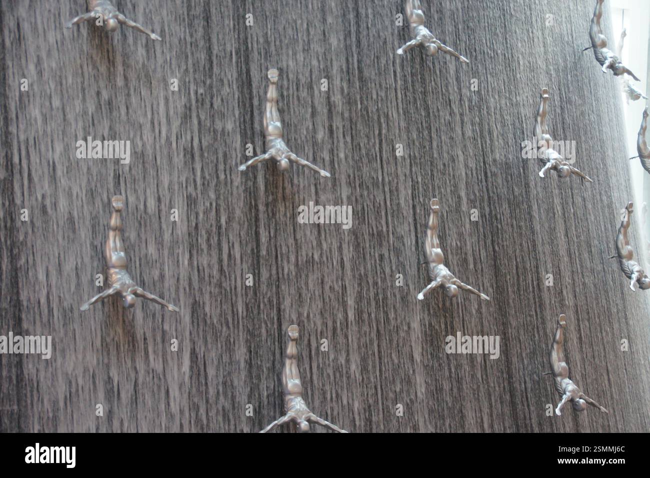 Dubai's towering water wall features a cascade of sculptures, their ...