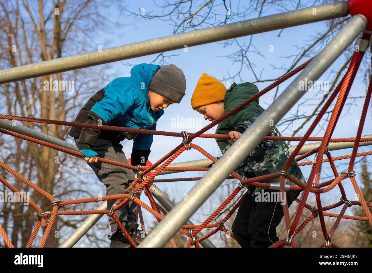 Two boys playing on the playground in the spring Stock Photo - Alamy