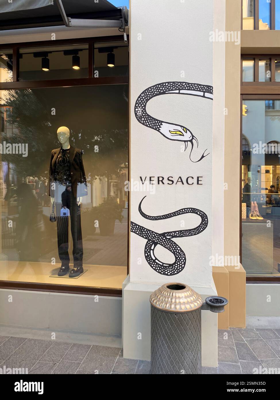 Stylish storefront of Versace boutique showcasing the brand's signature ...
