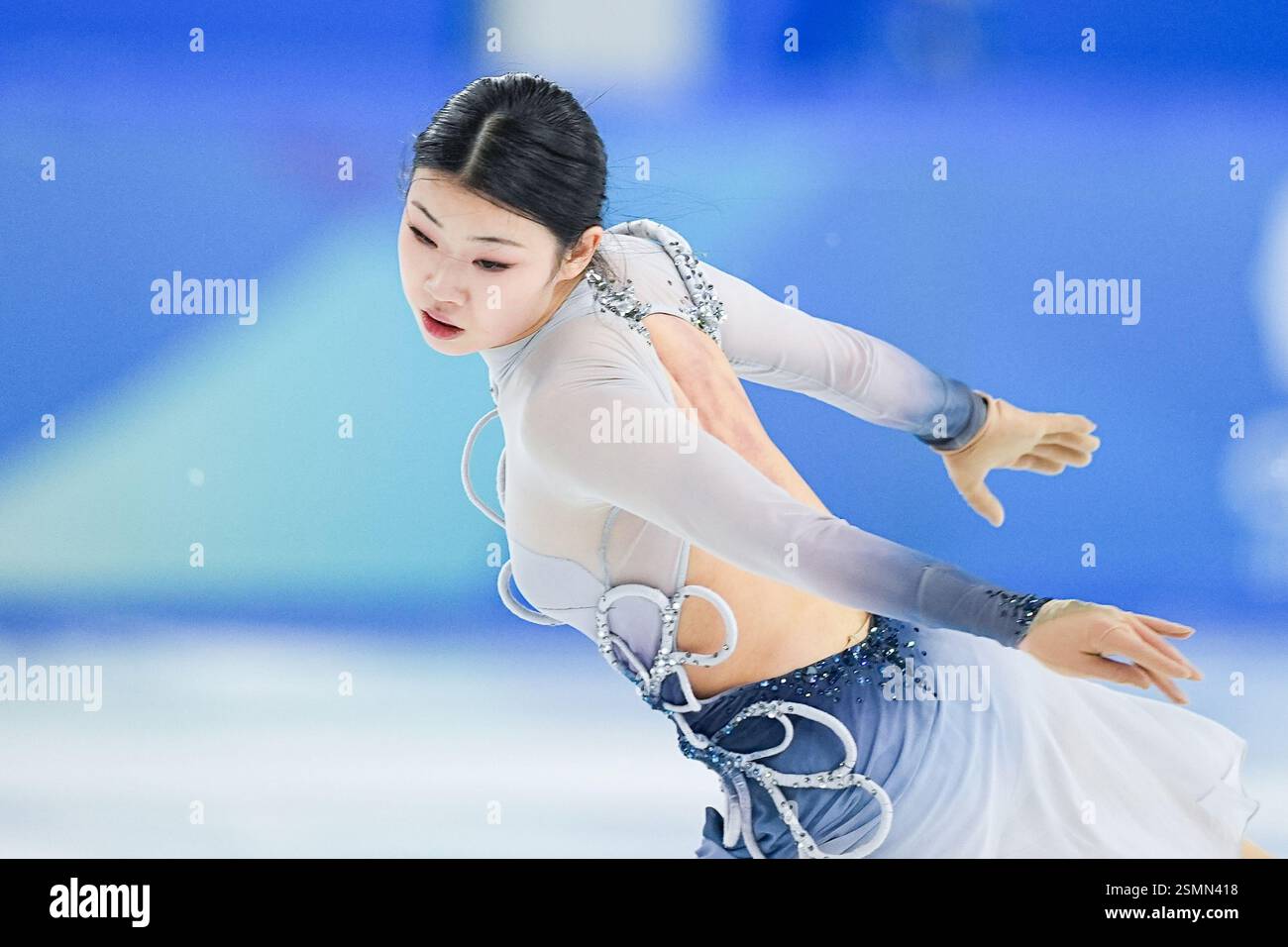 Harbin,China.12th February 2025. An Xiangyi of China competes in the ...