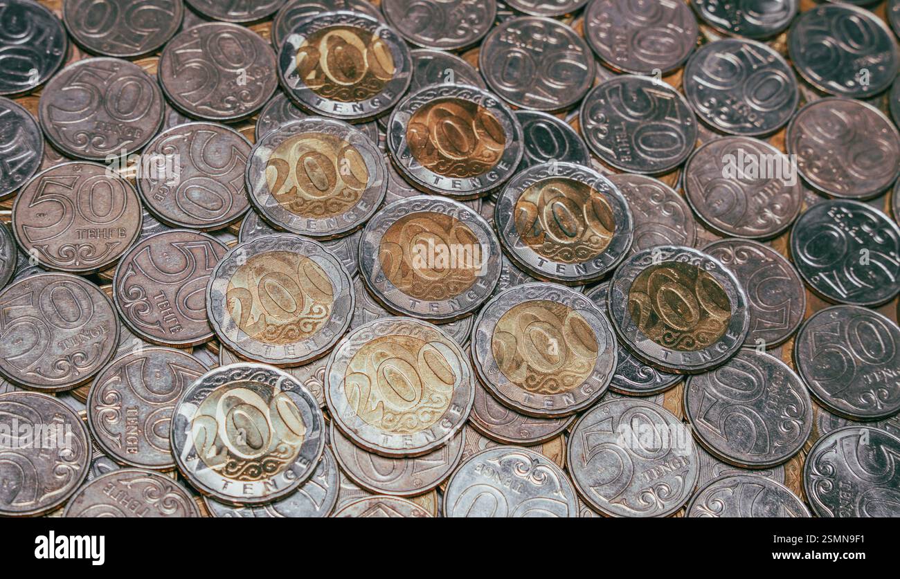 Coins of 200 tenge denomination are laid out in a pyramid. Financial ...