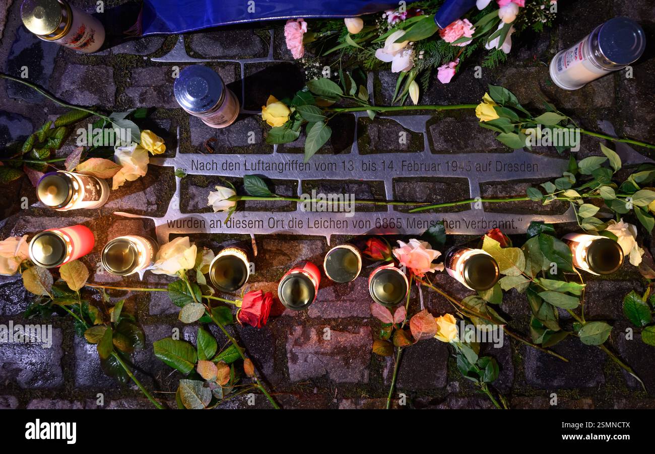 Dresden, Germany. 16th Oct, 2024. Roses and candles are laid on the ...