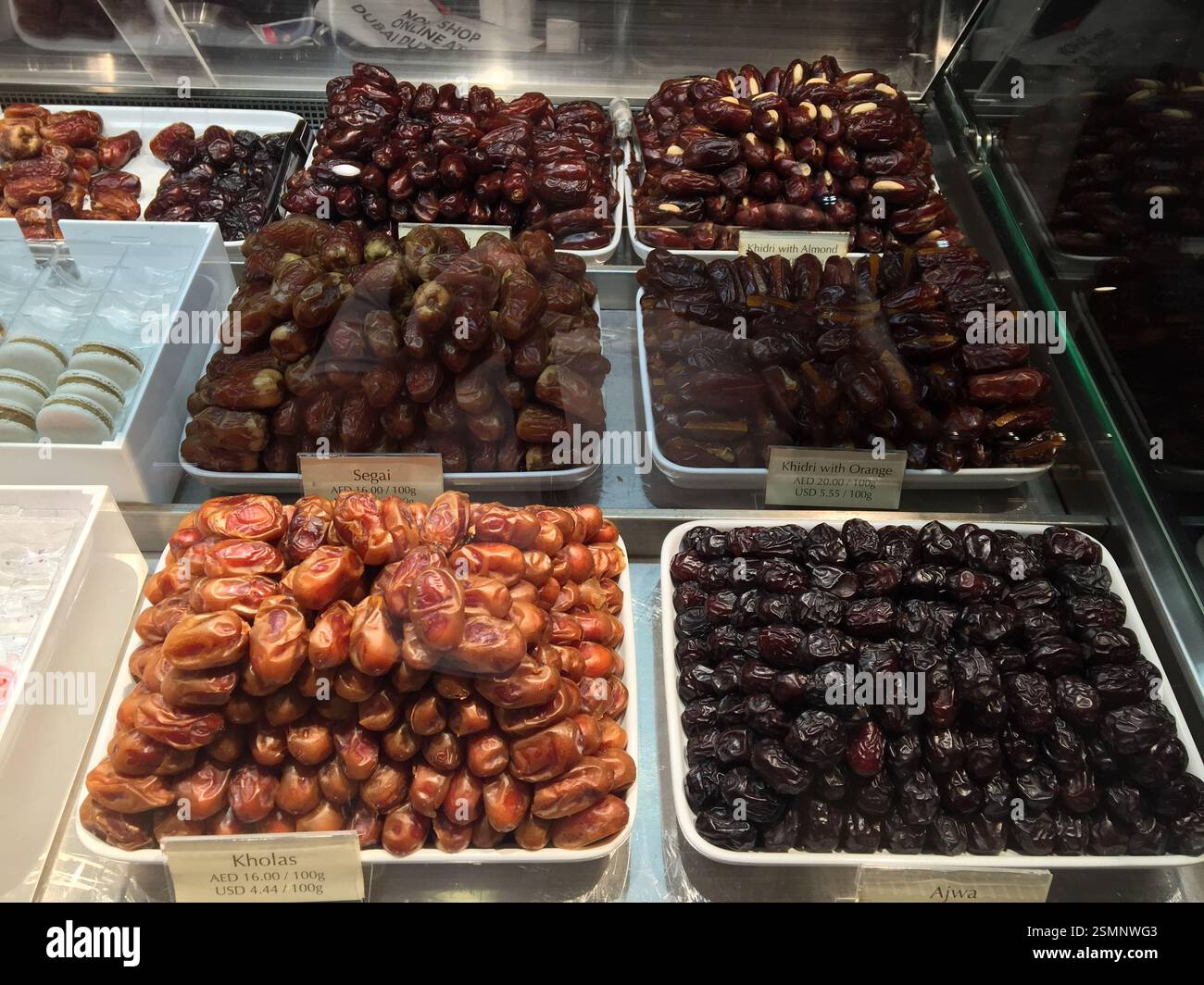 A display case in Dubai overflows with colorful dates, each variety ...
