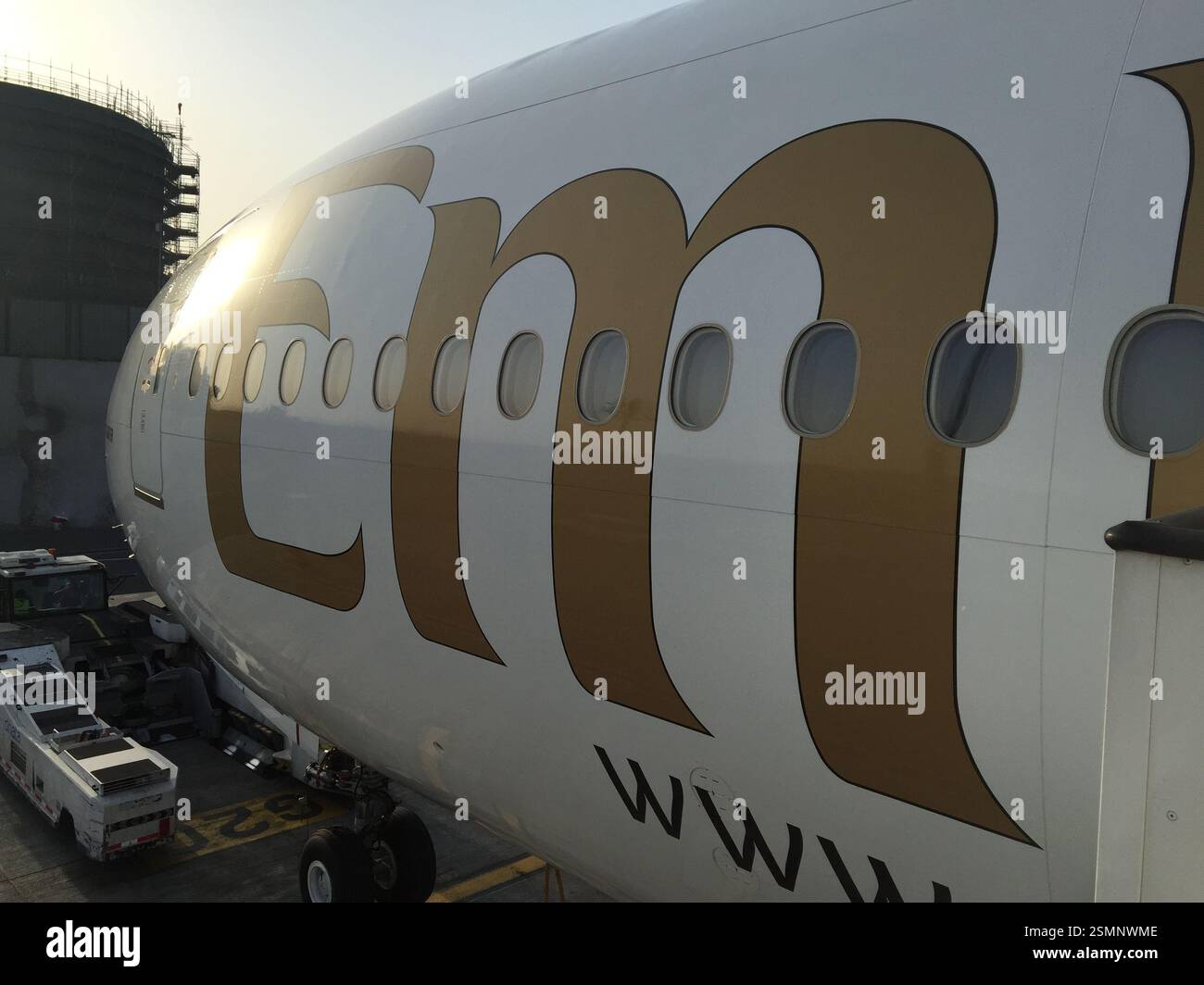 A gleaming Emirates Airbus A380, its iconic white and gold livery ...