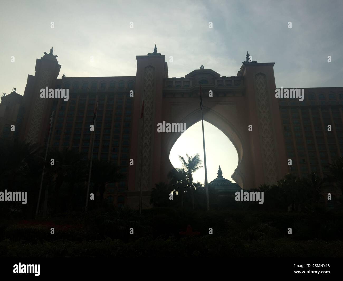 Dubai hotel architecture. A dramatic silhouette stands tall against a ...