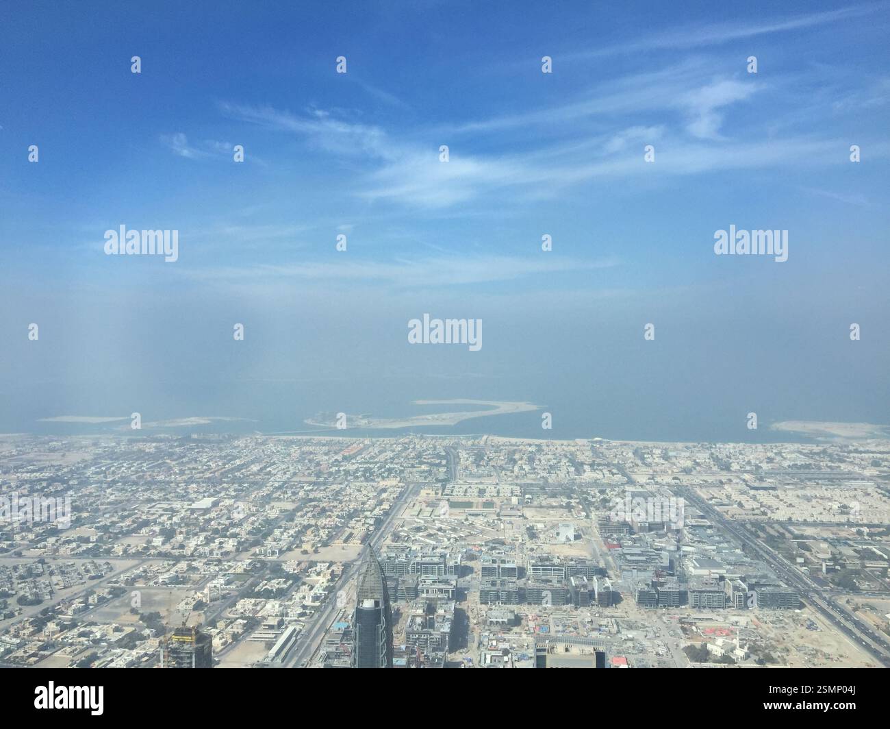 Dubai skyline from above. Expansive urban landscape with artificial ...