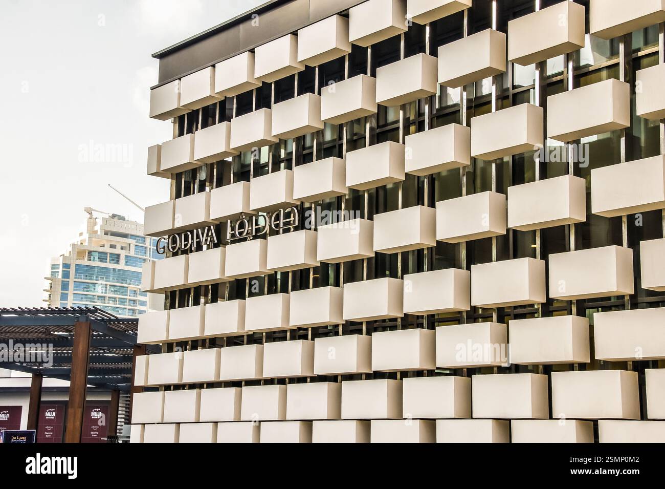 Dubai's towering skyscraper boasts a gleaming white facade with ...