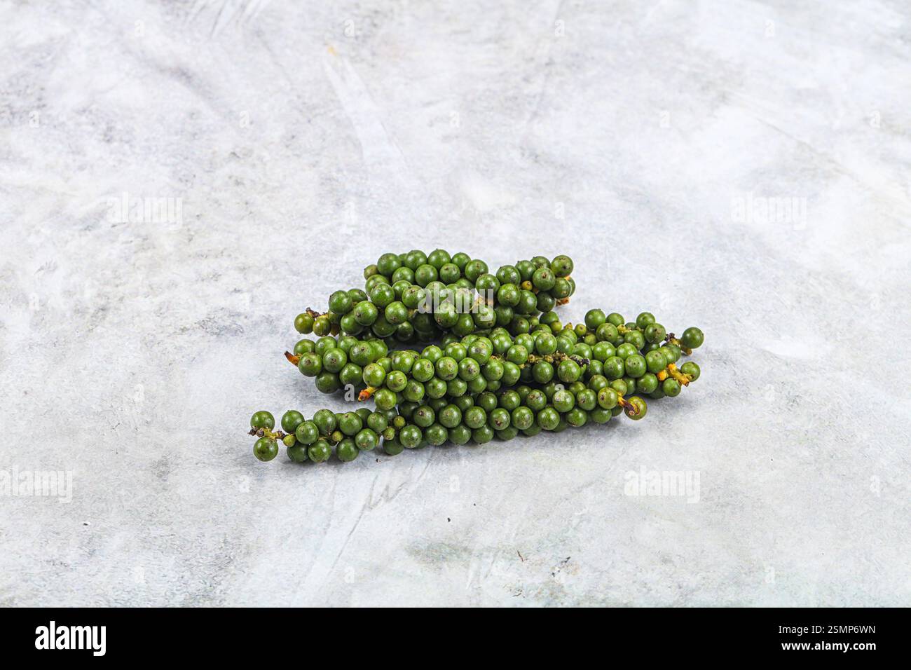 Green pepper corn on the branch heap Stock Photo - Alamy