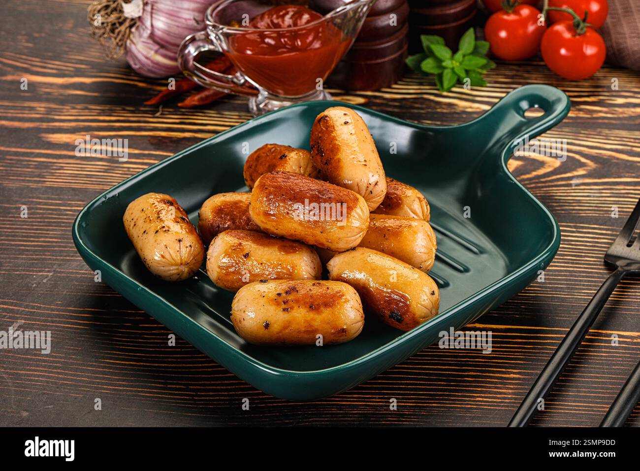 Roasted chicken mini sausages for breakfast in the bowl Stock Photo - Alamy