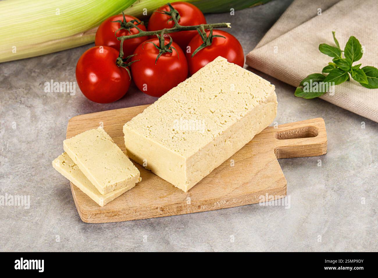 Soya vegan tofu cheese brick over board Stock Photo - Alamy