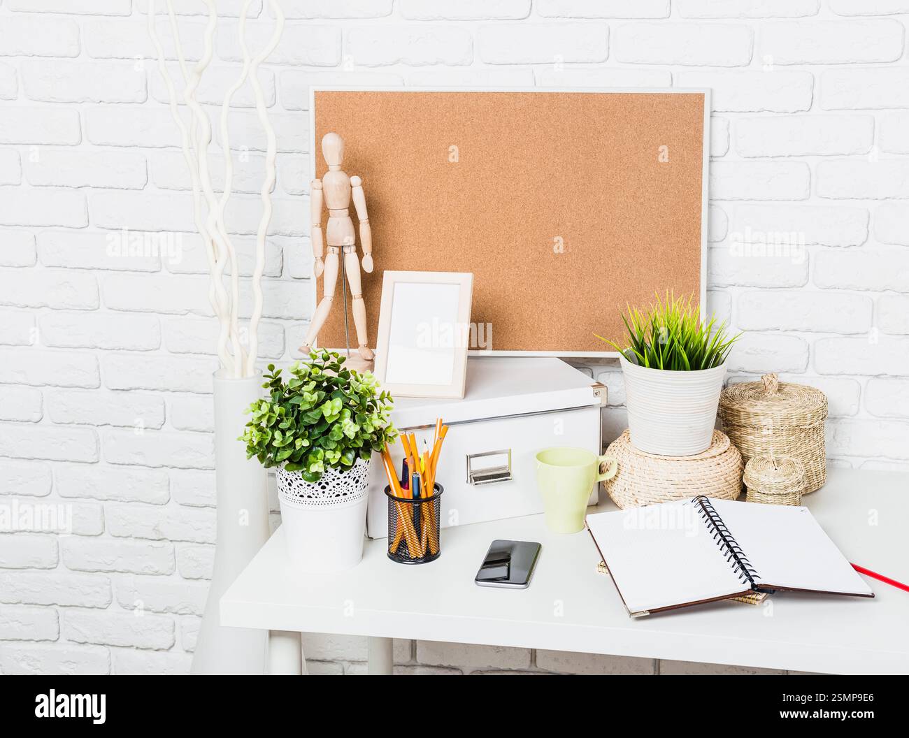 Workspace arrangement with decorative elements and organizational tools on a bright desk Stock ...