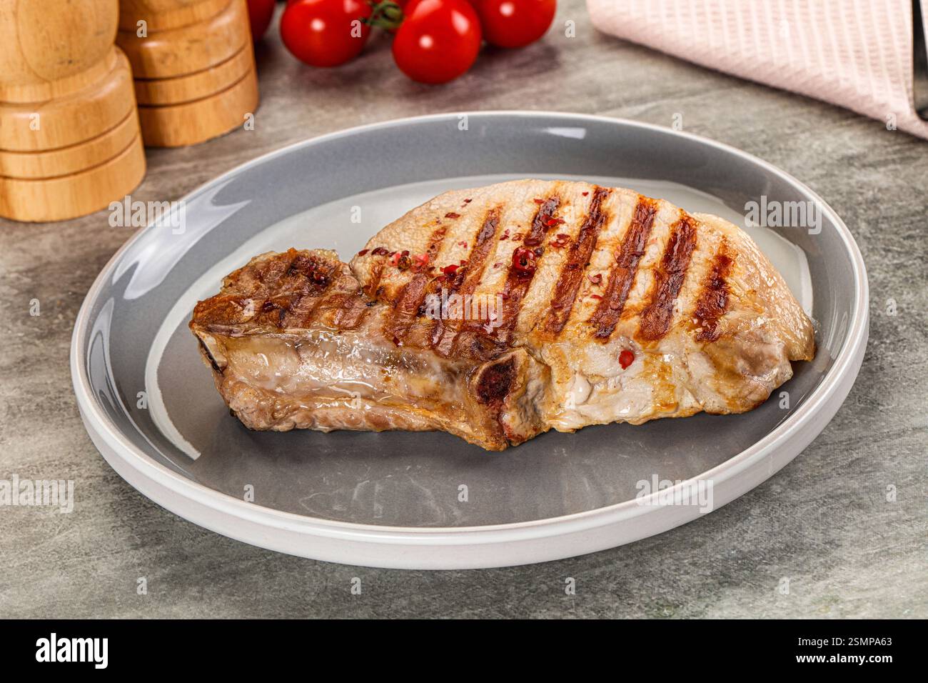 Grilled fat pork loin steak with bone Stock Photo - Alamy