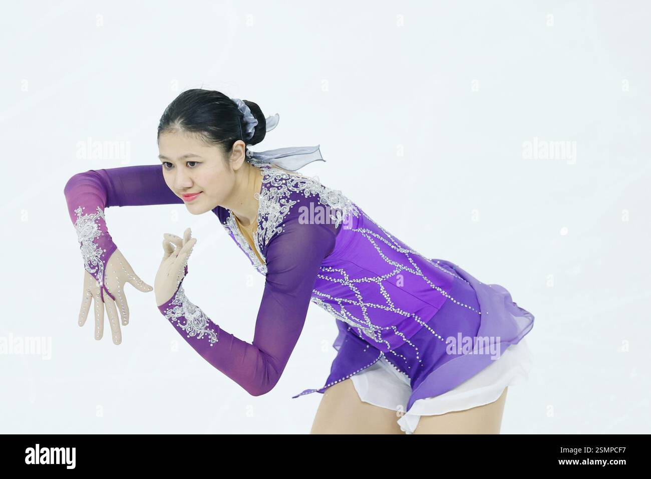 Harbin,China.12th February 2025. Afrina Diyanah of Malaysia competes in ...