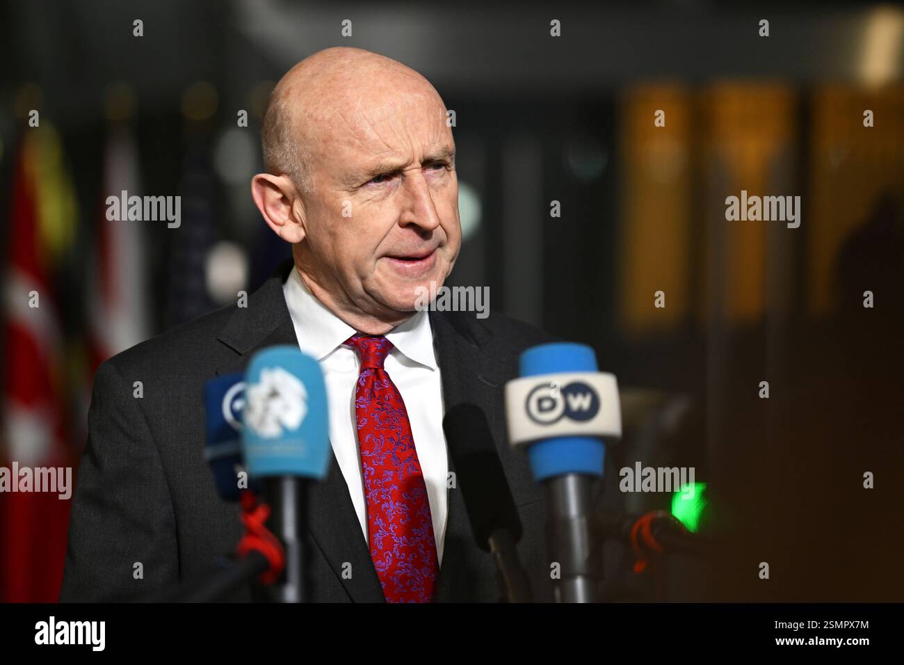 Britain's Defense Secretary John Healey speaks with the media as he ...