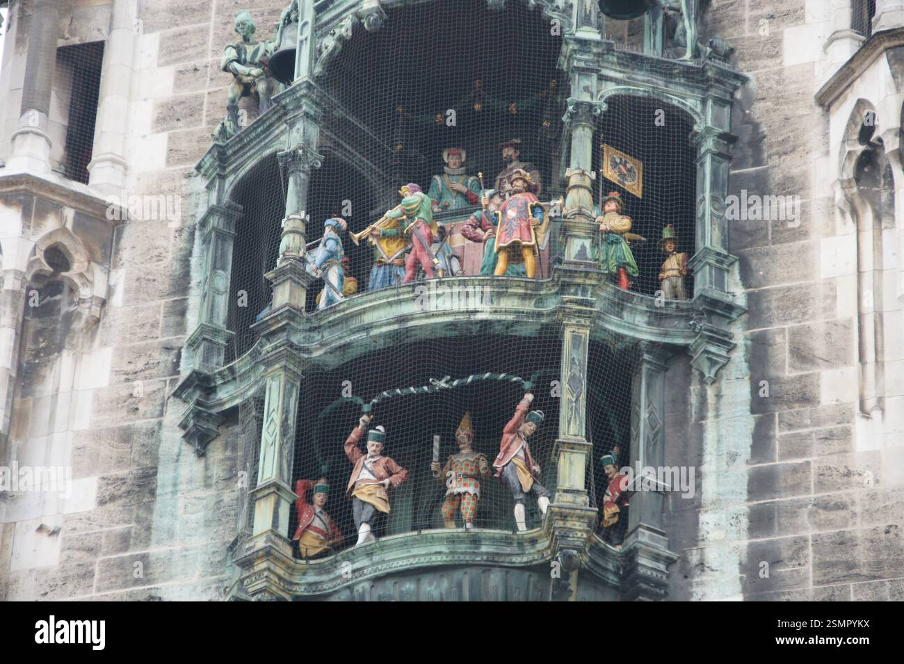 Ornate clock tower with figures chiming bells on a balcony, possibly ...