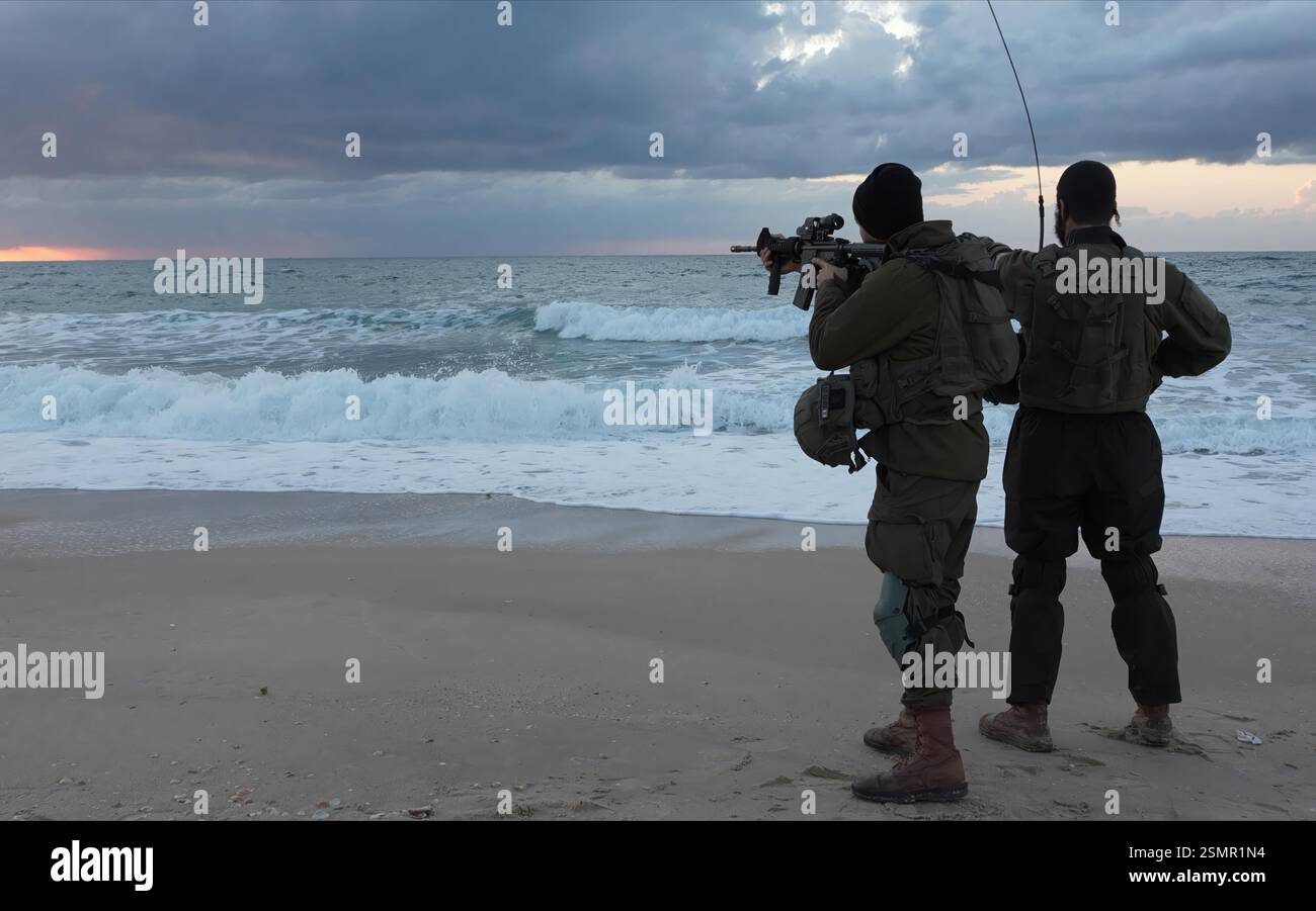 Israeli soldiers stand guard in Zikim beach, south of Ashkelon near the ...