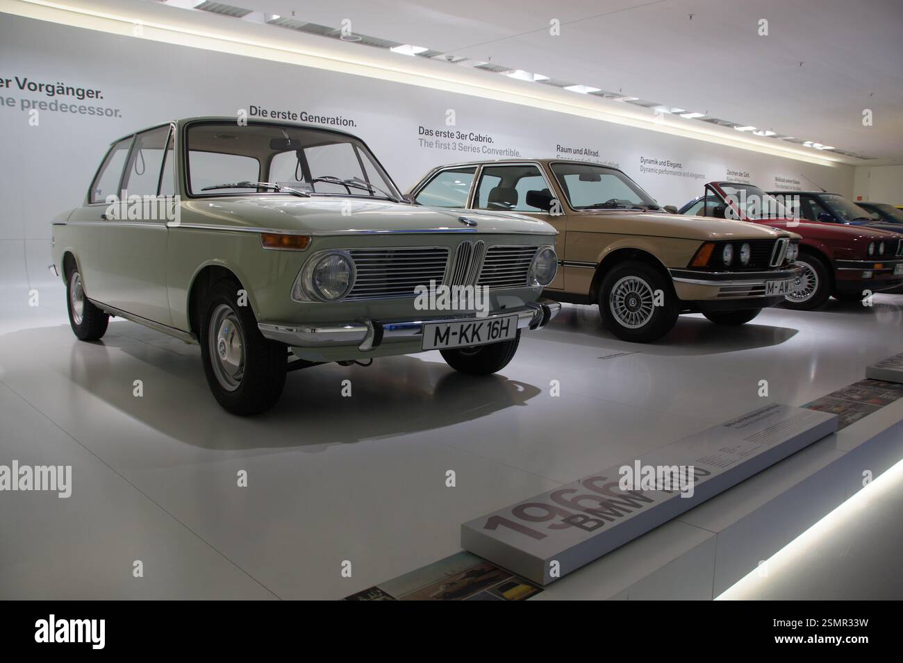 A row of classic BMW cars on display at the BMW Museum, Germany, Munich ...