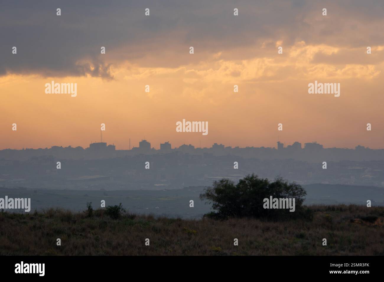 Sunset over Gaza City as it seen from Israeli side of the border with ...