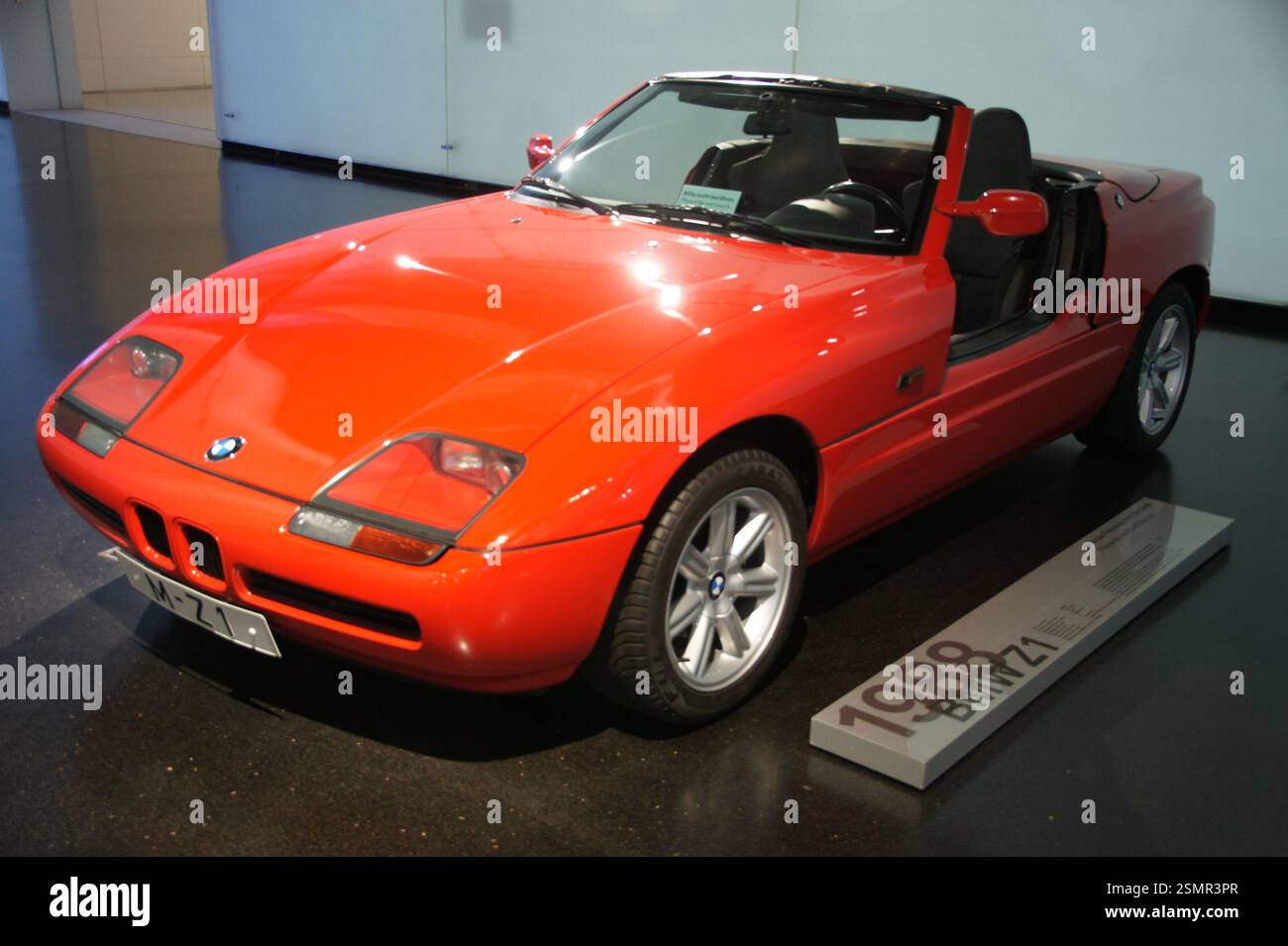Red BMW Z1 convertible with doors open, on display at the BMW Museum in ...
