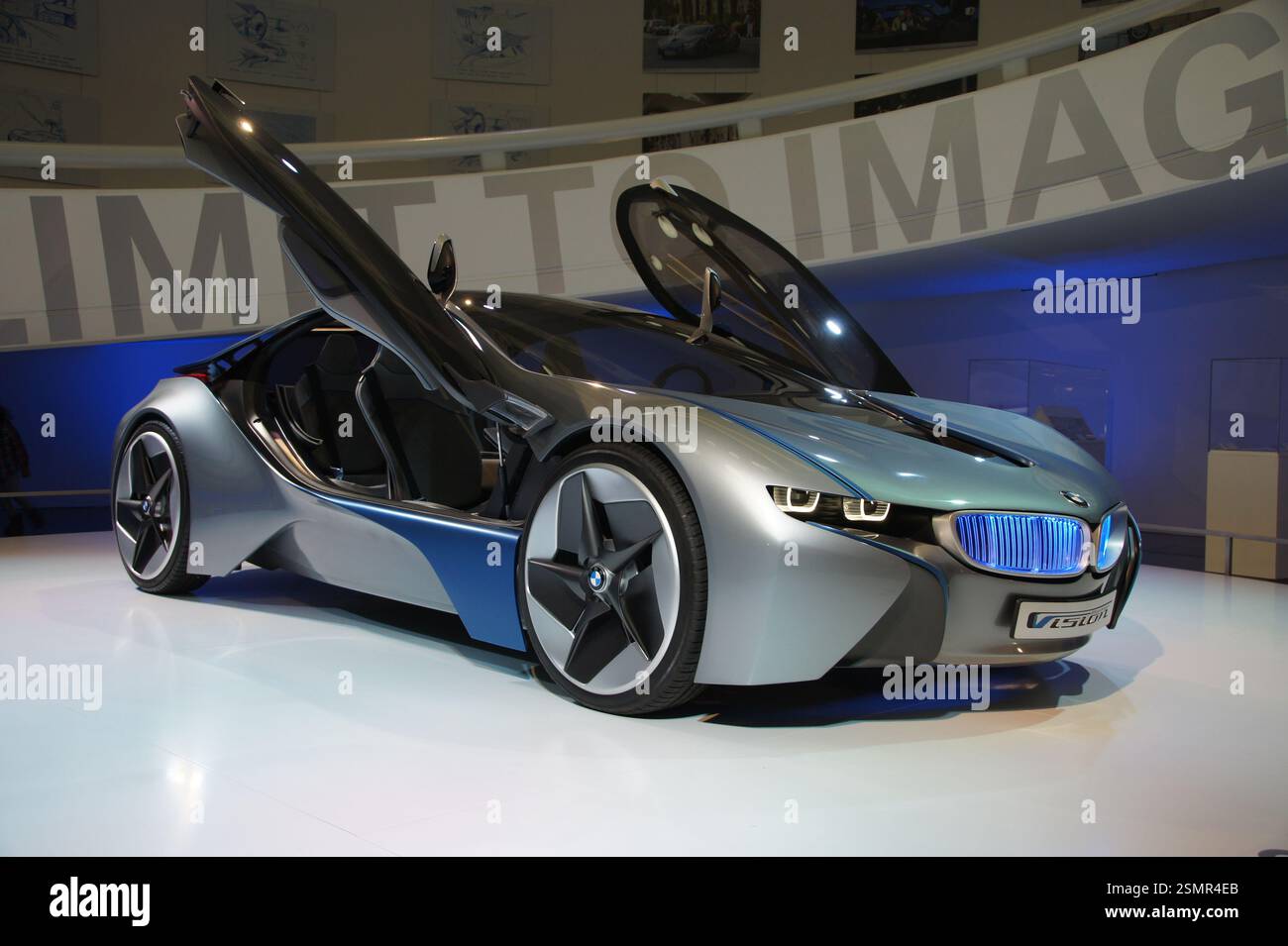 A white BMW i8 concept car with butterfly doors open is on display in ...