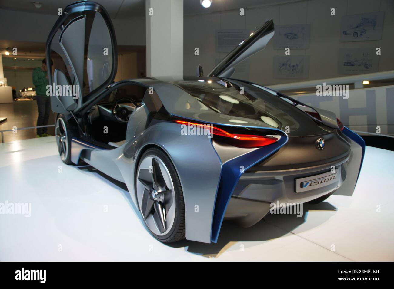 A futuristic BMW i8 concept car with butterfly doors and a hybrid ...