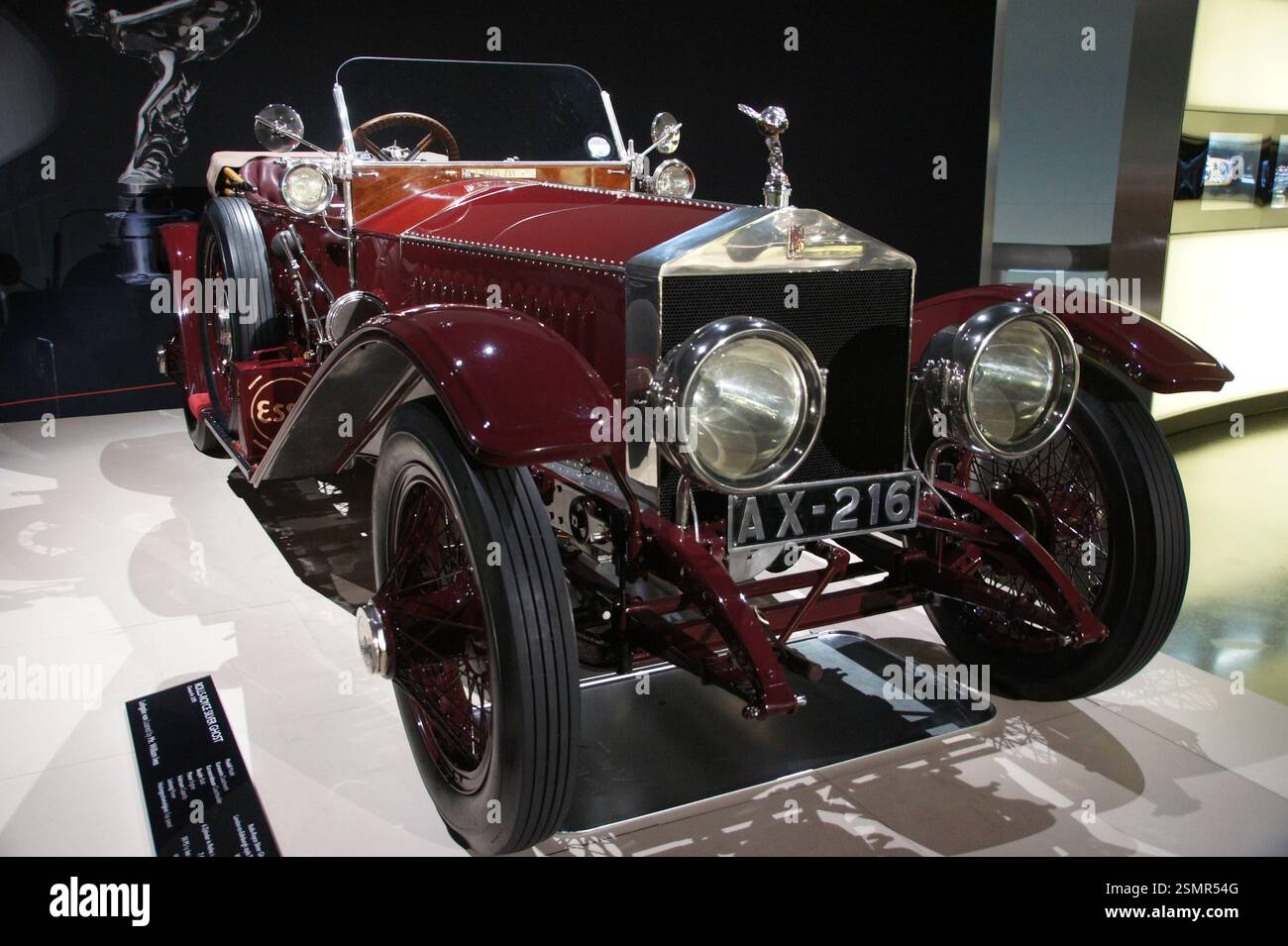 A red Rolls-Royce Silver Ghost with the license plate AX-216 gleams at ...