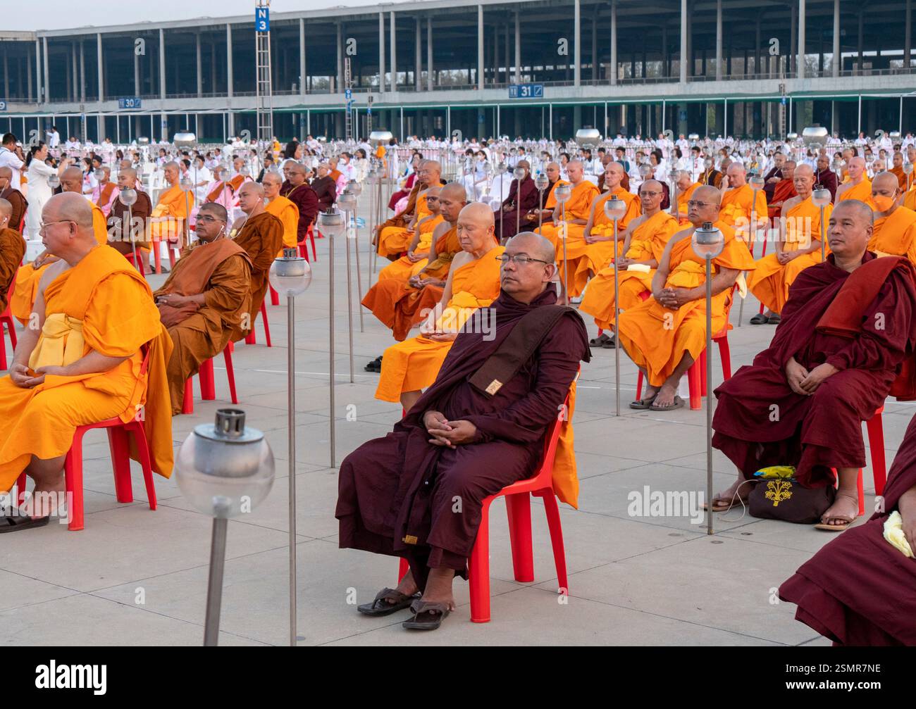 Monks sit during Makha Bucha Day ceremonies at Wat Phra Dhammakaya ...