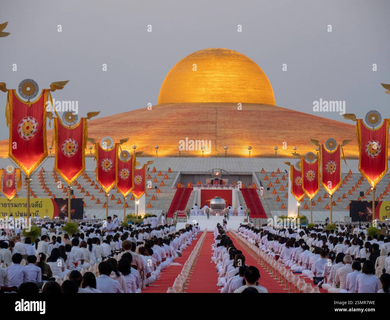 People pray during Makha Bucha Day ceremonies at Wat Phra Dhammakaya ...